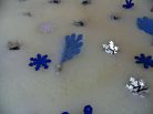 Sparkly Winter Sensory Bin with Snowflake Letters from And Next Comes L