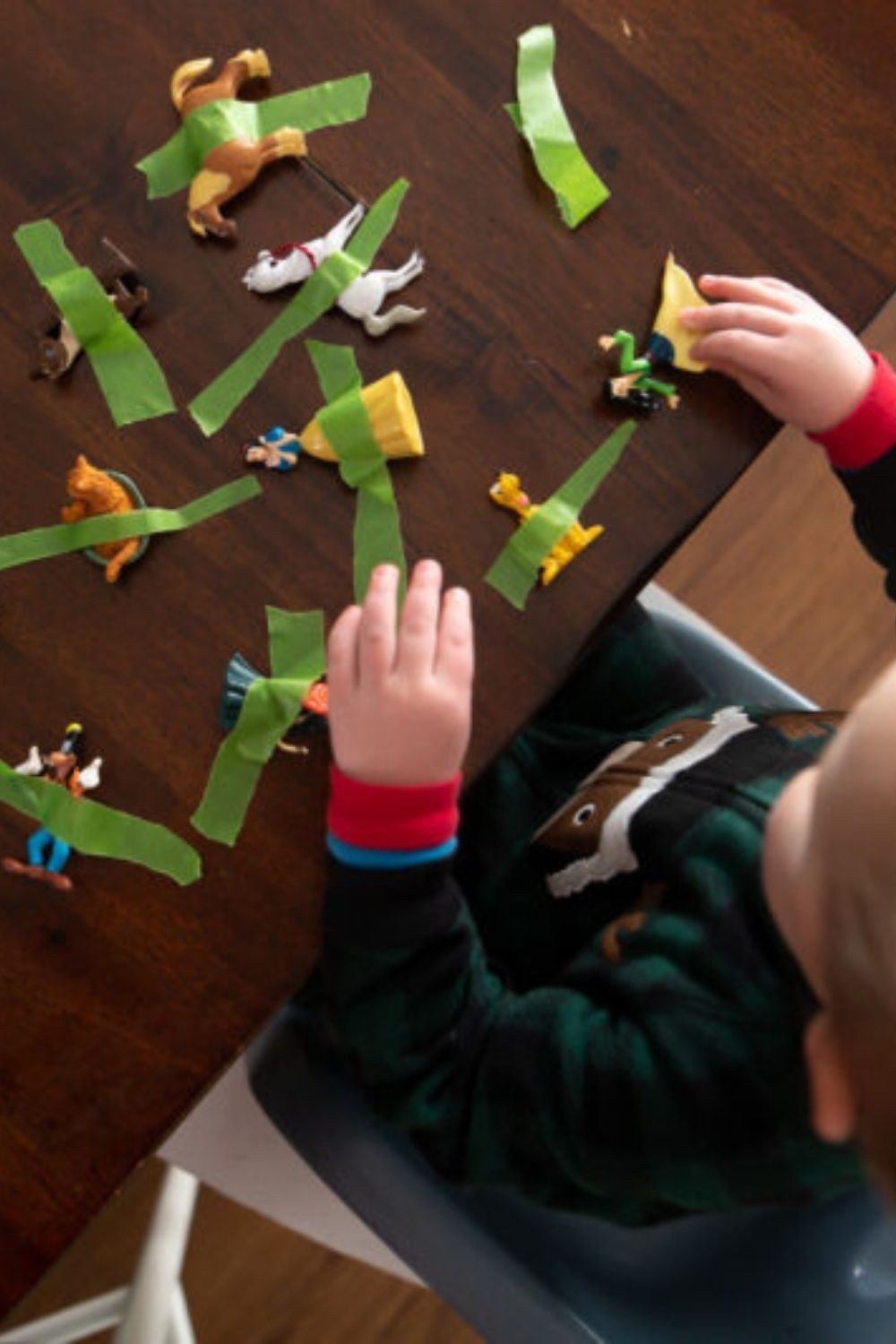Peeling Tape Activity to Strengthen Little Toddler Fingers - HOAWG