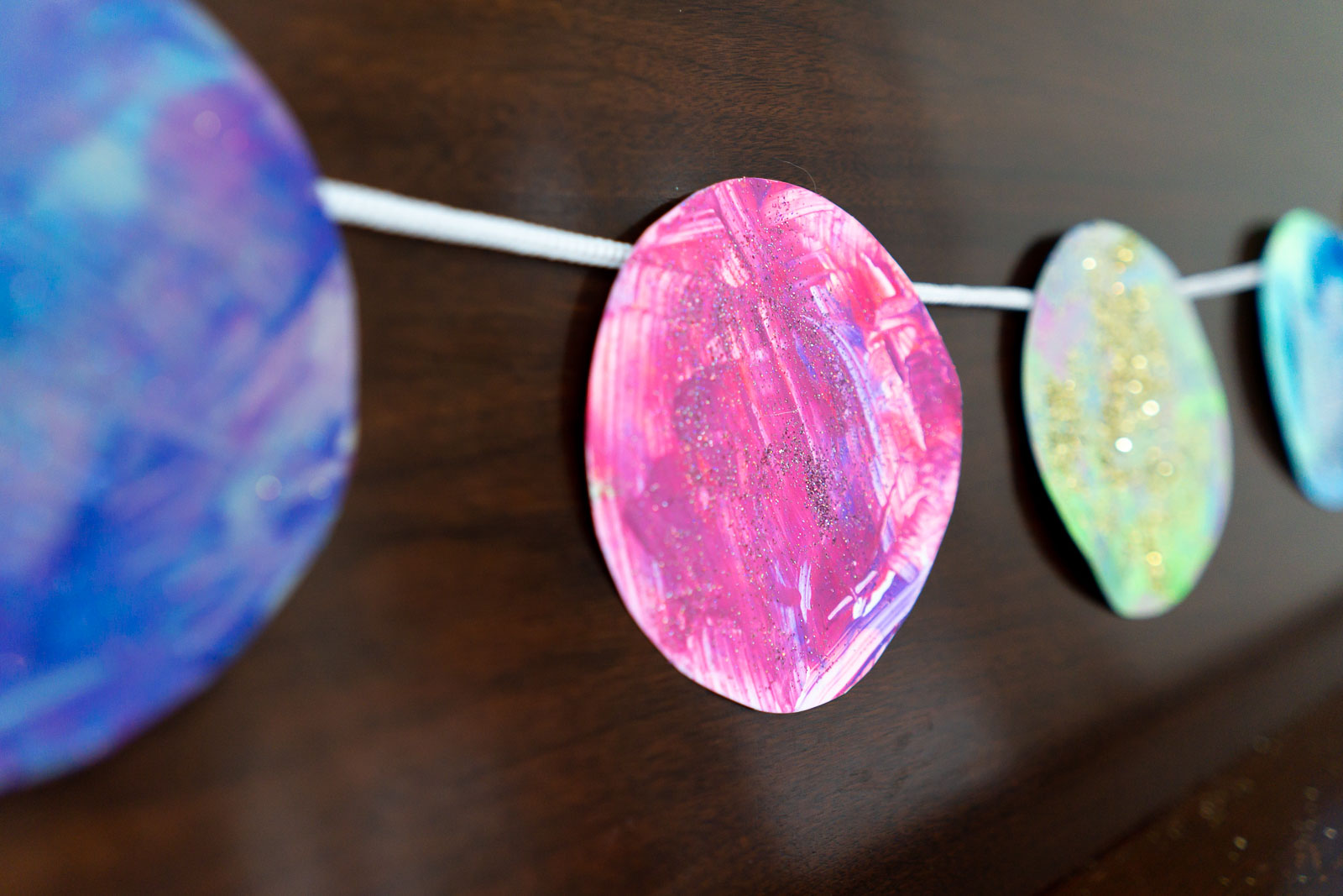 A Great Garland Craft Made From Your Child's Sparkly Scrape Art