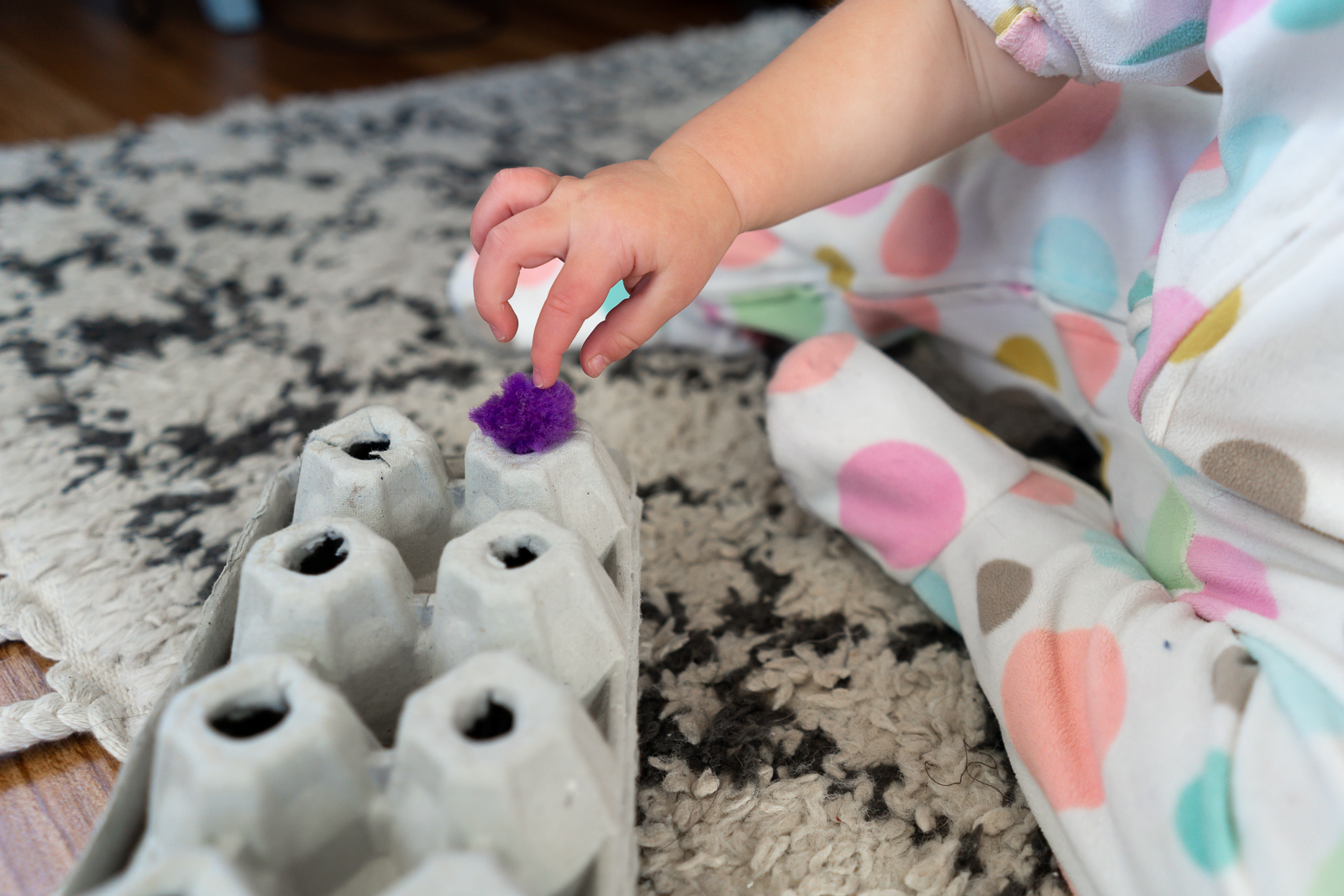 Pom Pom Push Fine Motor Activity to Keep Toddlers Busy