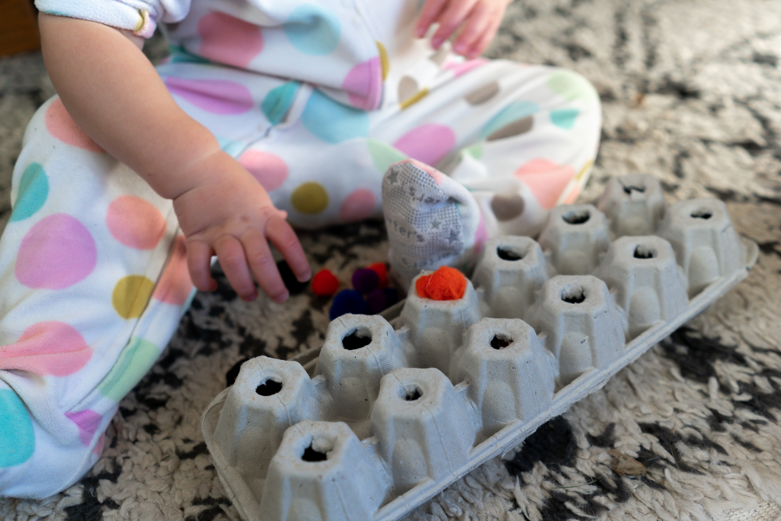 Pom Pom Push Fine Motor Activity to Keep Toddlers Busy